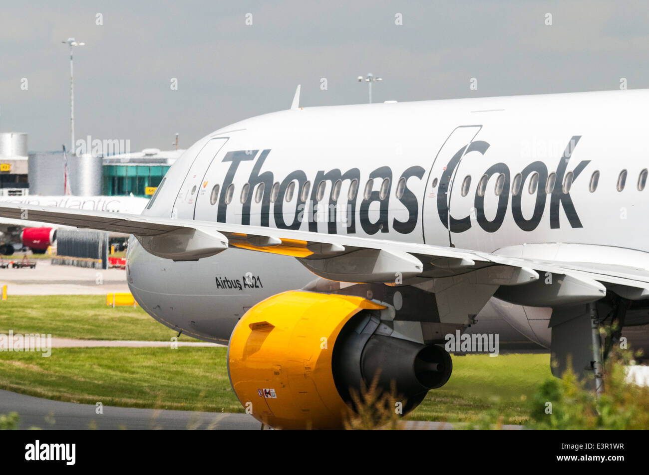 Closeup of a Thomas Cook Airbus A321 aircrafts engine and wing as it ...