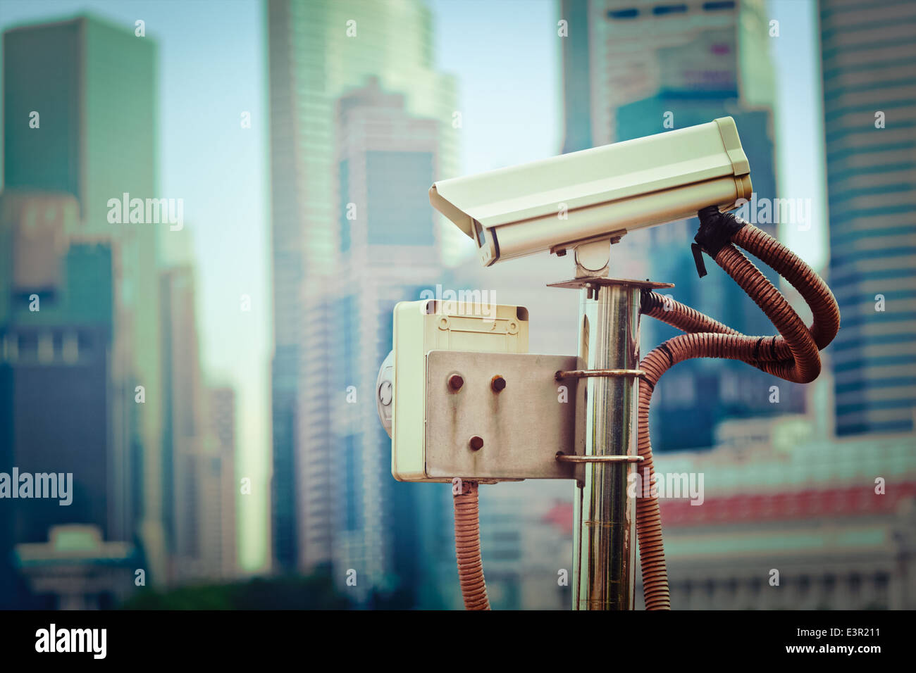 Vintage retro hipster style travel image of CCTV surveillance camera in ...