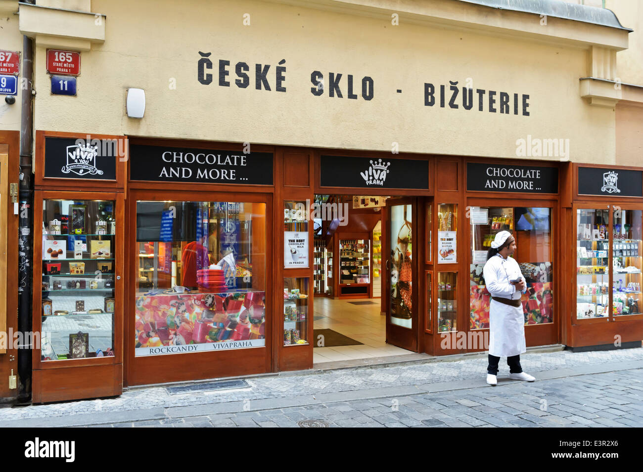 The exterior of chocolate shop with a man with a few samples of ...