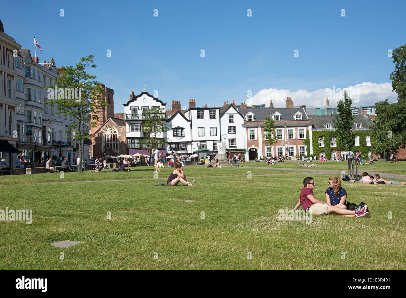 Cathedral Close in the city of Exeter Devon England UK Visitors sitting ...