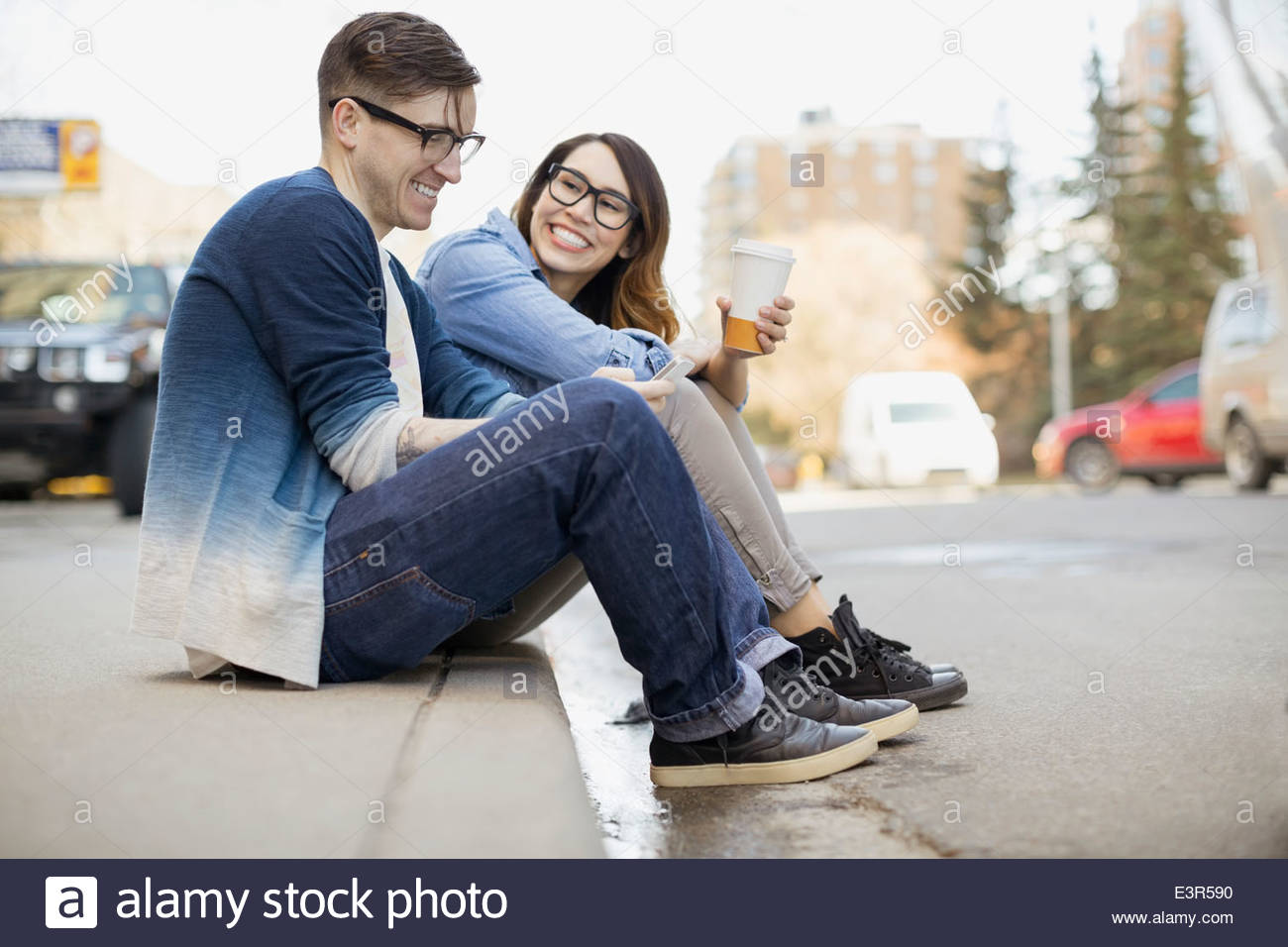 Young Woman Sitting On Curb Stock Photos & Young Woman Sitting On Curb ...