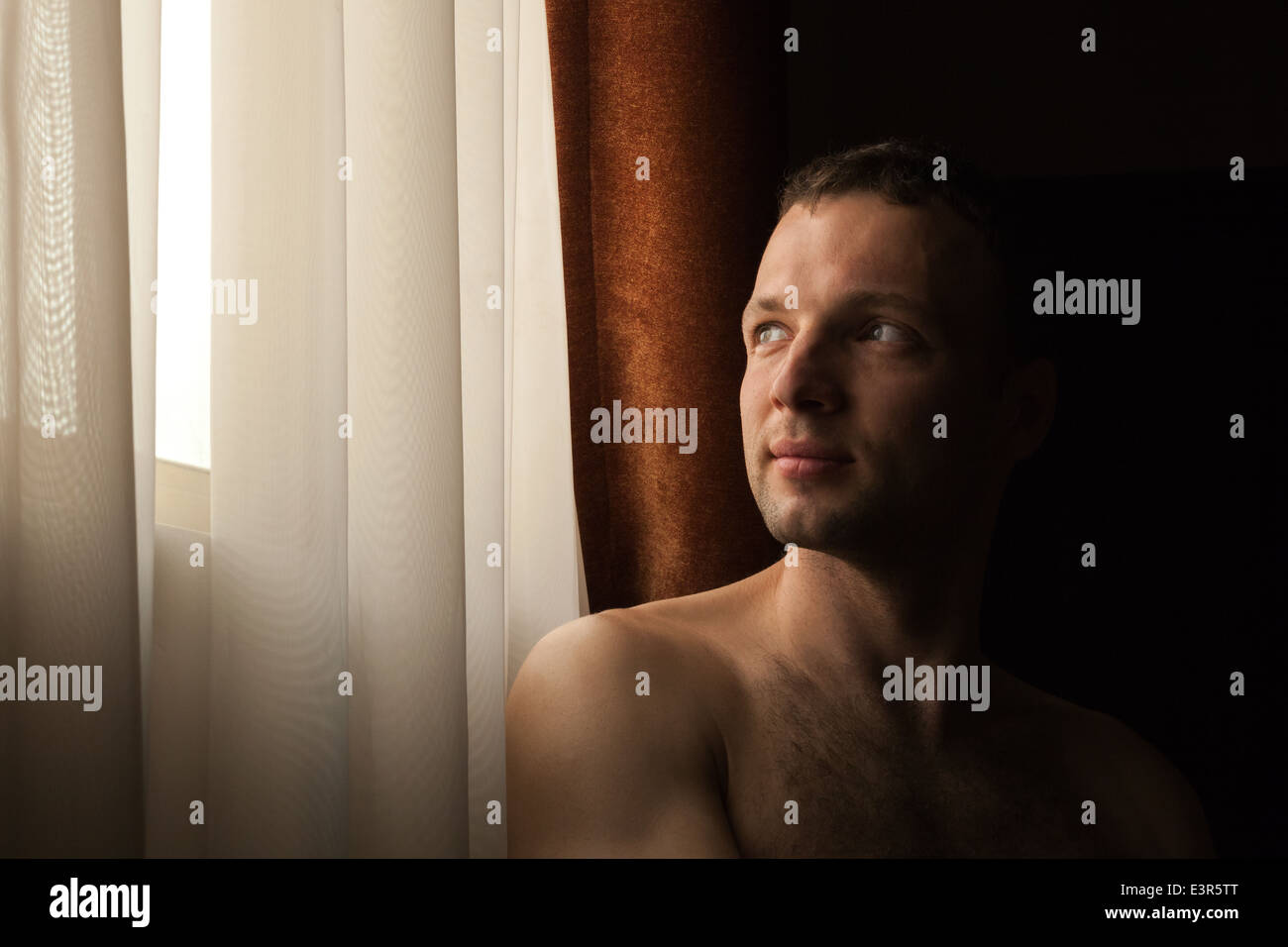Sad man window hi-res stock photography and images - Alamy