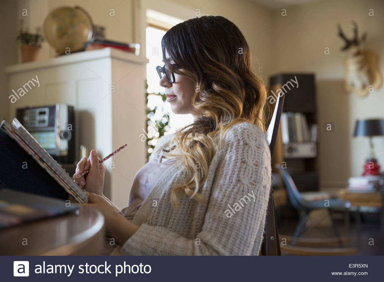 Woman writing in notebook hi-res stock photography and images - Alamy