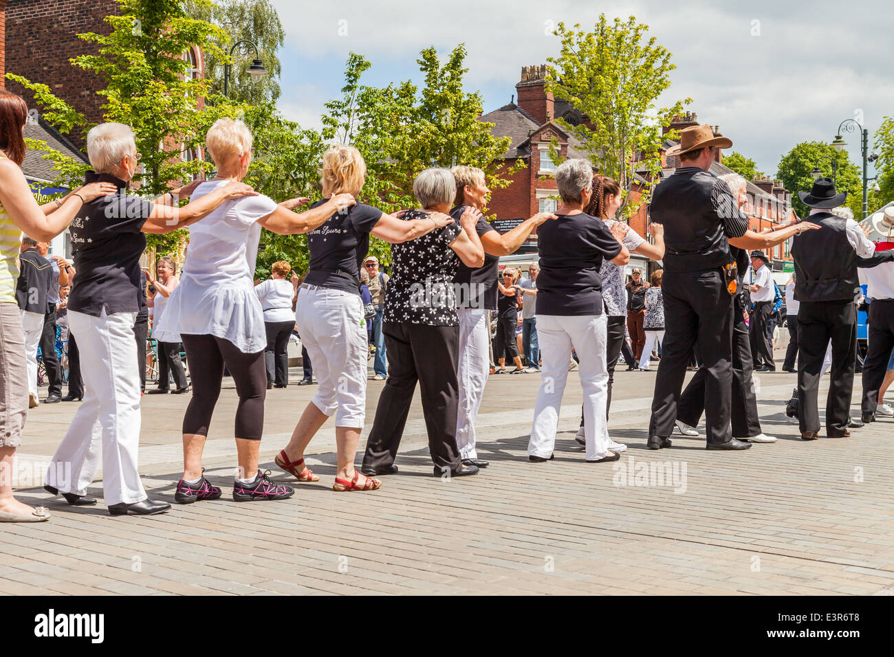 people line dancing in Leek town center. Leek, Staffordshire, England ...