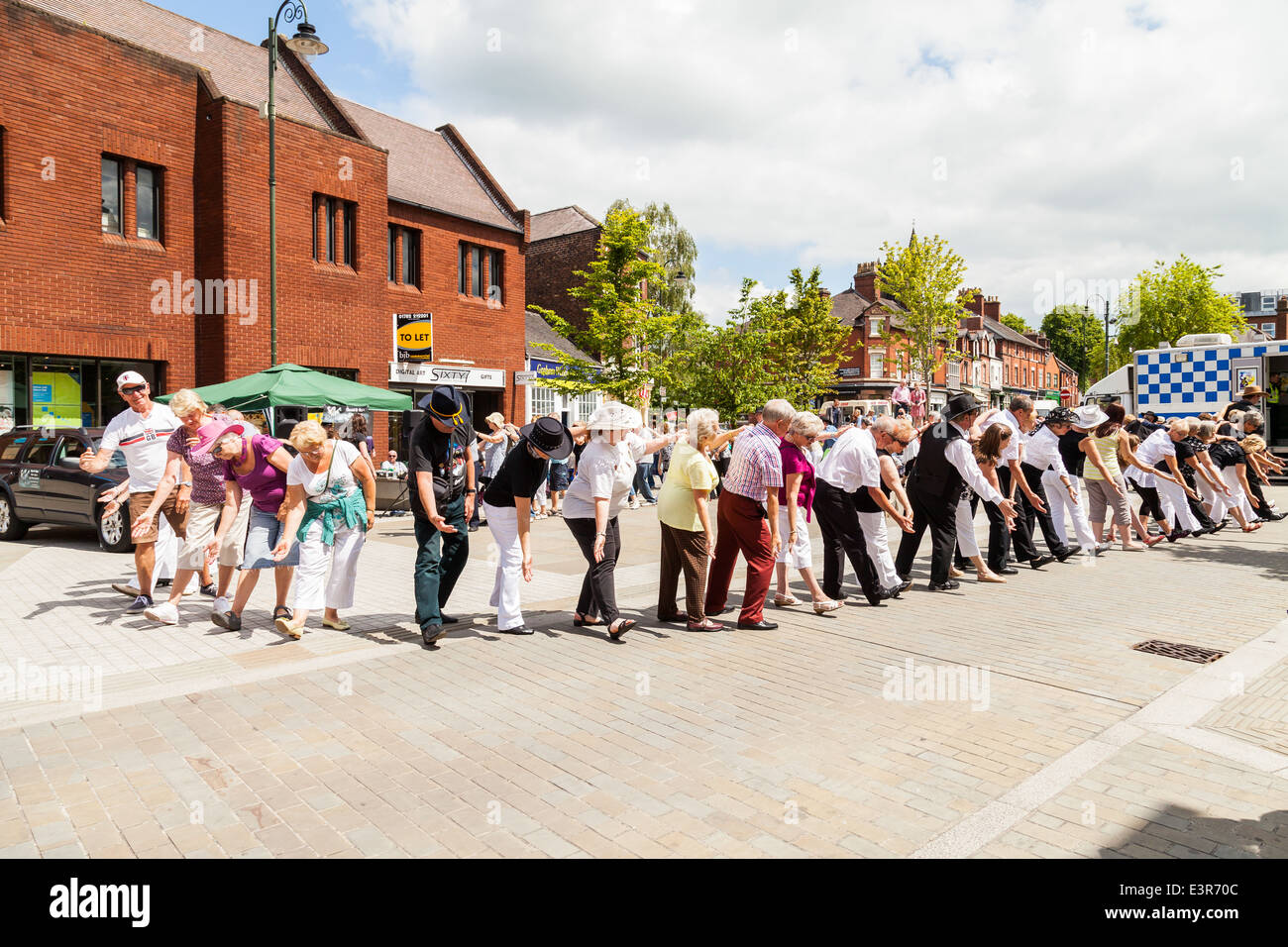 people line dancing in Leek town center. Leek, Staffordshire, England ...
