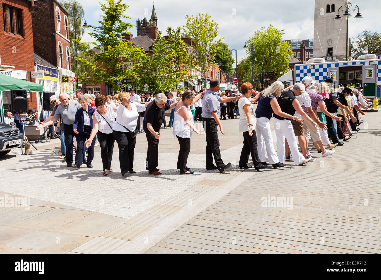 people line dancing in Leek town center. Leek, Staffordshire, England ...