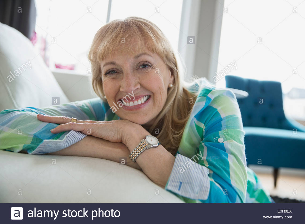 Woman laying on couch one person hi-res stock photography and images ...
