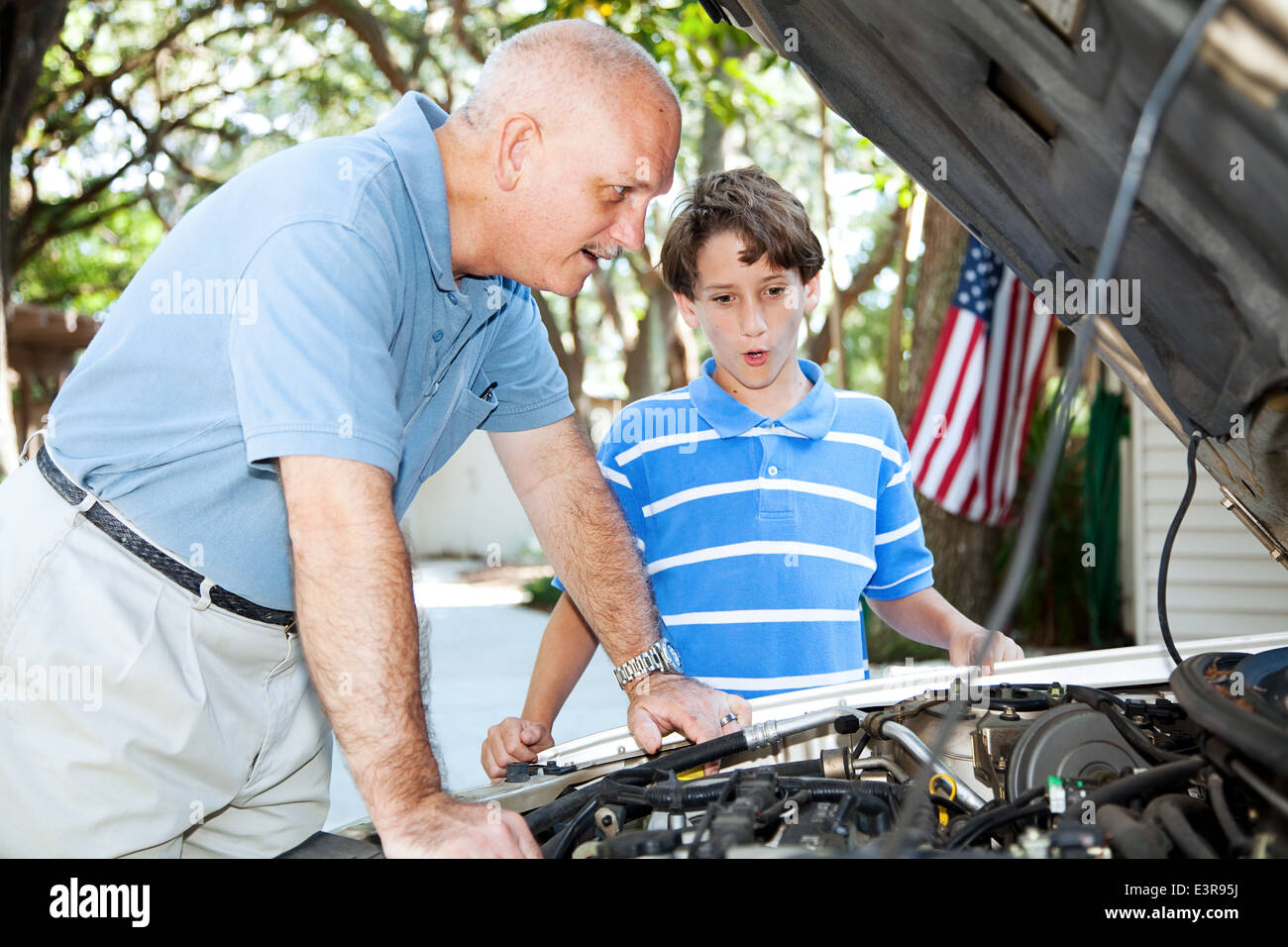 Father teaching his son how to do auto repair Stock Photo - Alamy