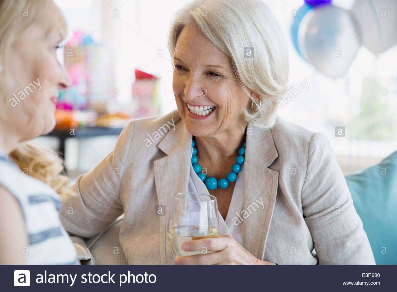 Women drinking wine at party Stock Photo - Alamy