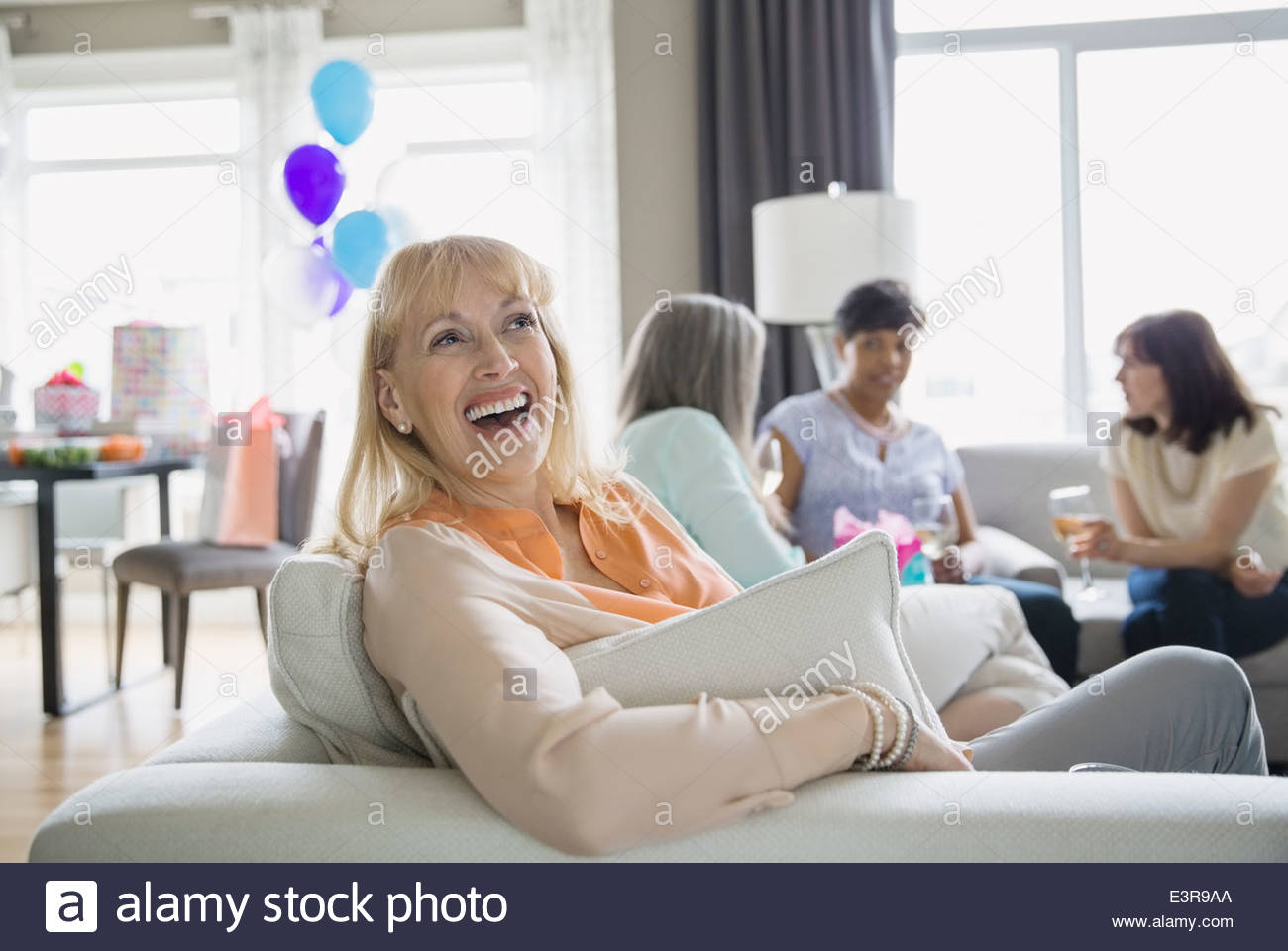 Happy lady enjoying her in living room hi-res stock photography and ...