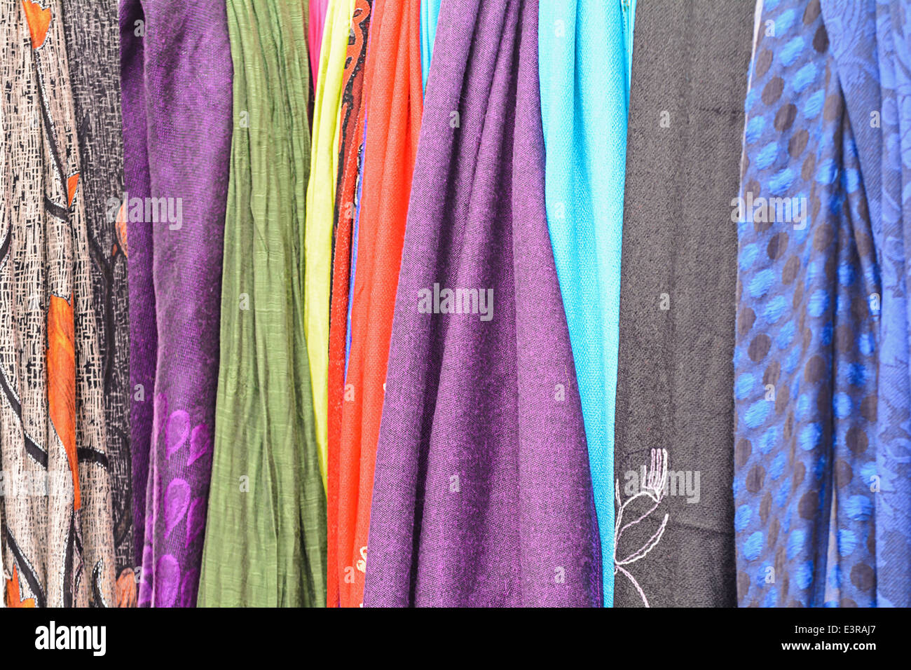 Colorful fabric textures hanging ,for a background Stock Photo - Alamy