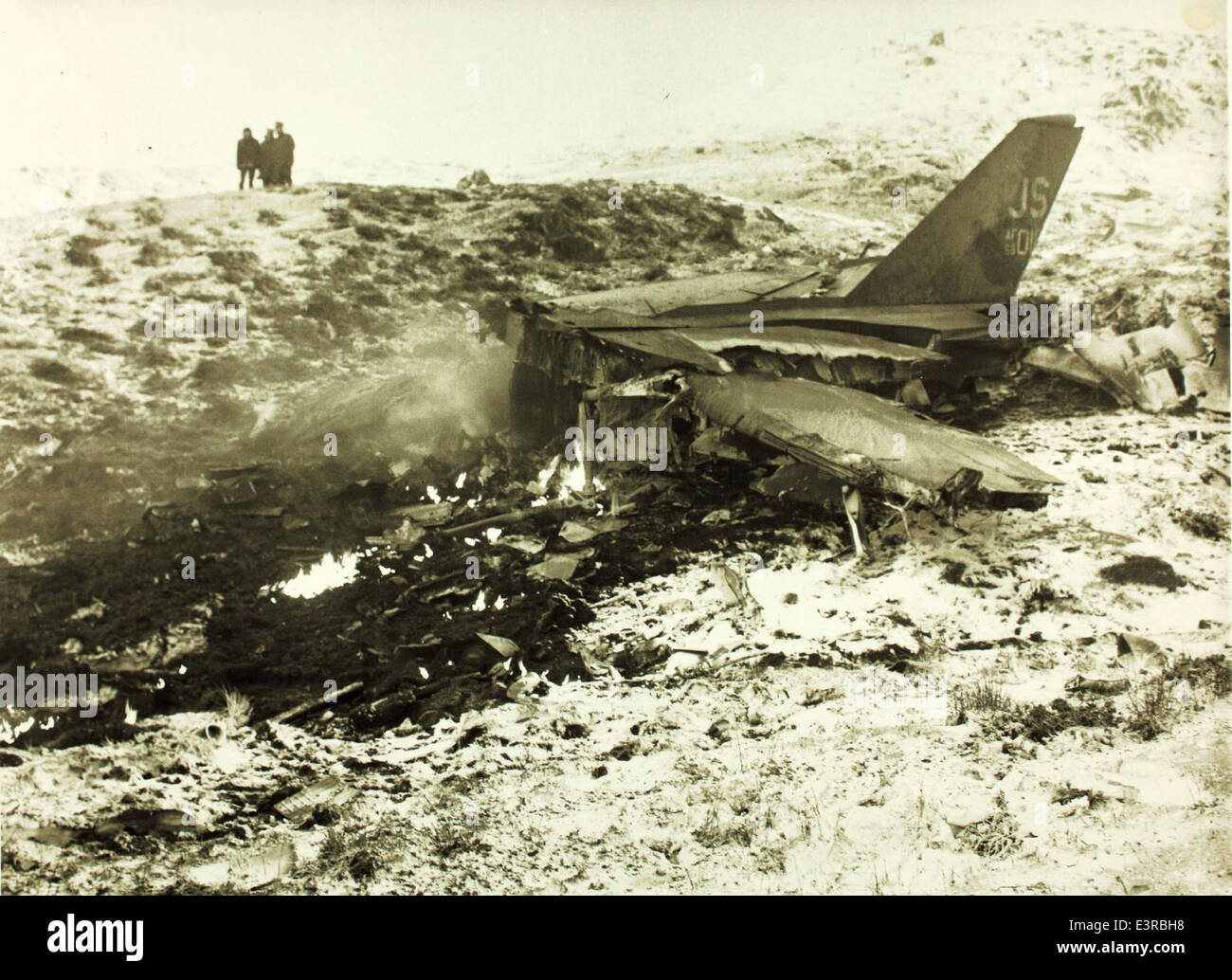 This image documents the aftermath of an F-111 Aardvark crash ...
