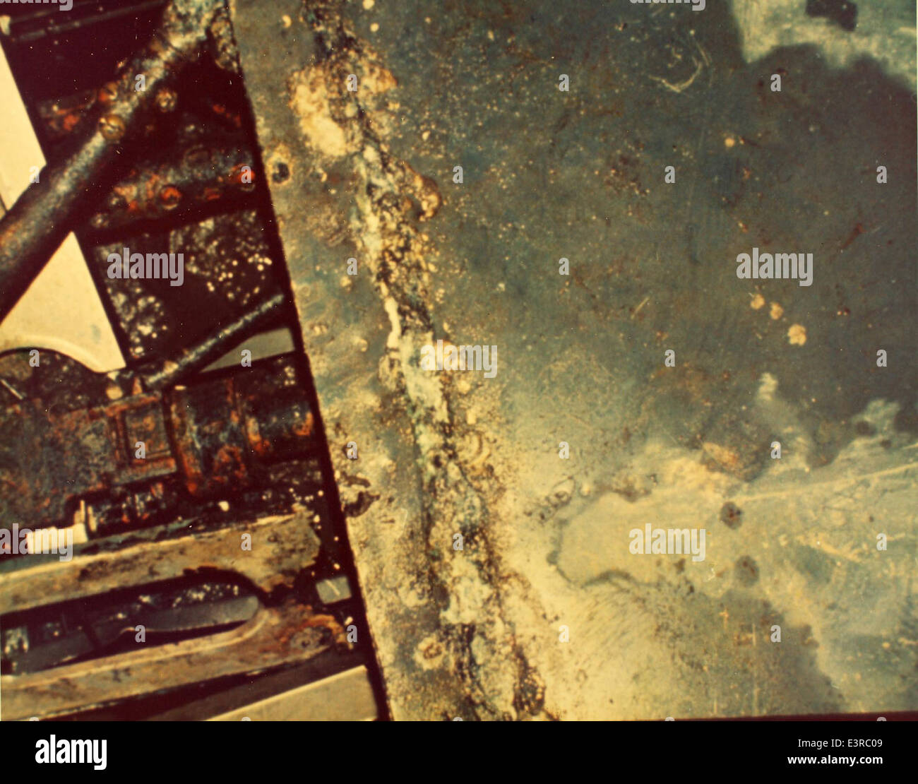 This image captures the aftermath of a crash involving a Grumman F6F ...