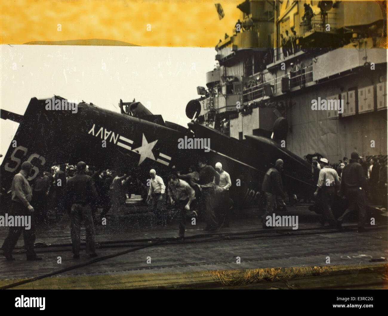 This photo documents the aftermath of a Douglas A-1 Skyraider crash, a ...