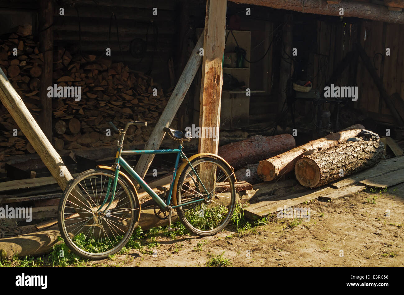 the old bicycle in the yard of the rural house Stock Photo - Alamy