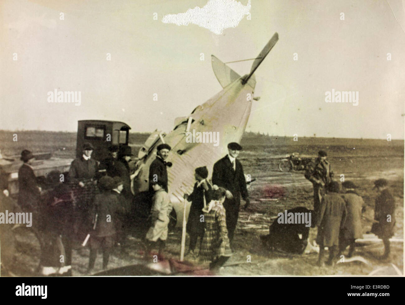 This image depicts an aircraft accident, capturing the aftermath of a ...