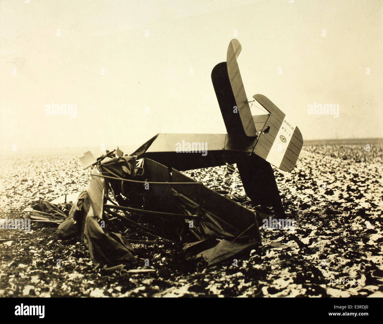 This image shows the aftermath of a Consolidated PT-1 crash, a training ...