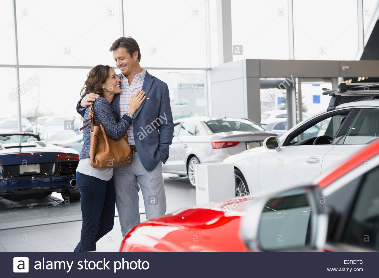 Happy couple hugging in automobile hi-res stock photography and images ...