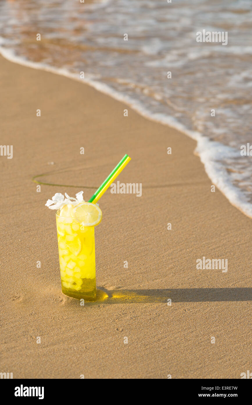 A chilled lemon cocktail on a sunny beach Stock Photo - Alamy