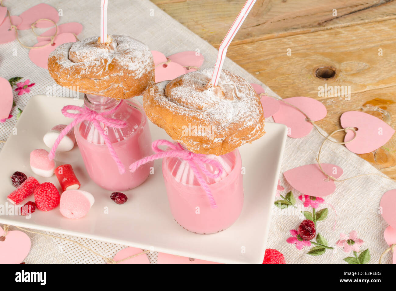 Traditional Spanish ensaimada topping a strawberry milkshake, a sweet ...