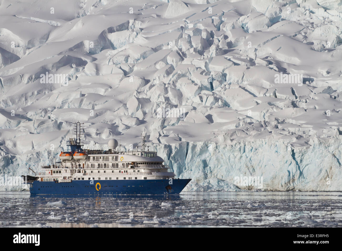 blue tourist ship on the background of a summer day glaciers of the ...