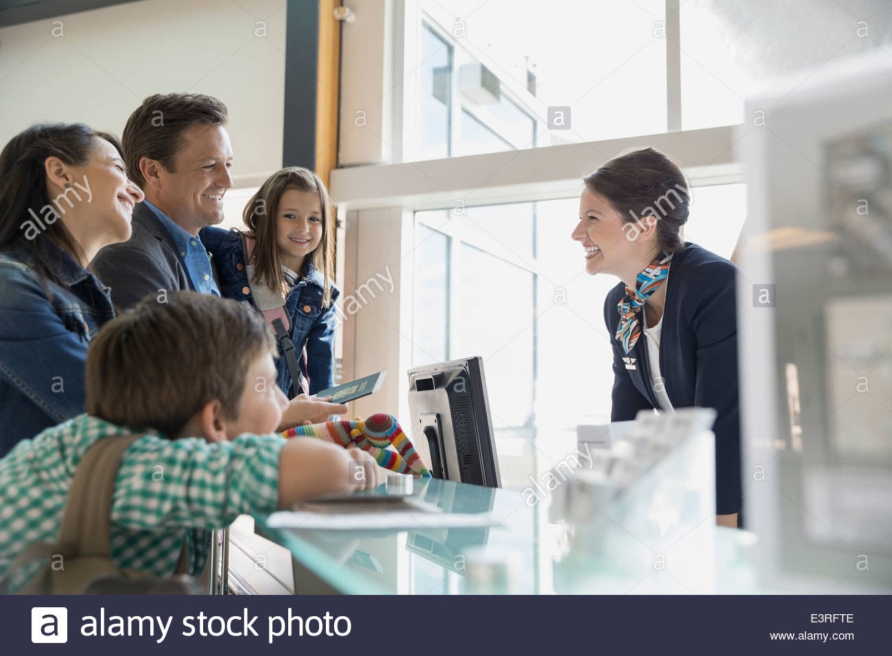 Family and airport and passport hi-res stock photography and images - Alamy