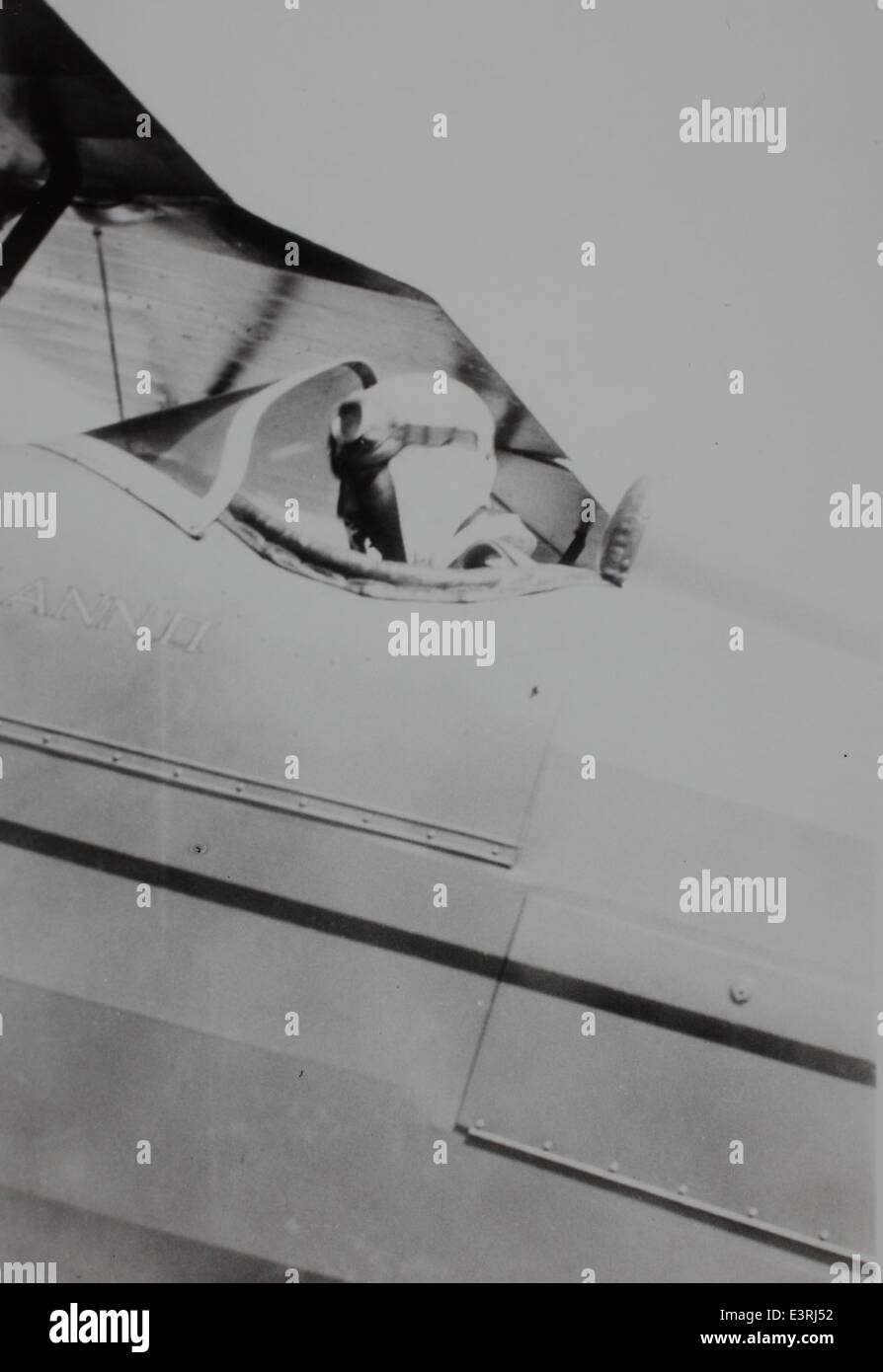 This image shows a woman pilot in the cockpit, symbolizing the ...