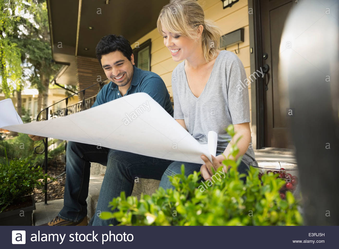 Young woman sitting on stoop hi-res stock photography and images - Alamy