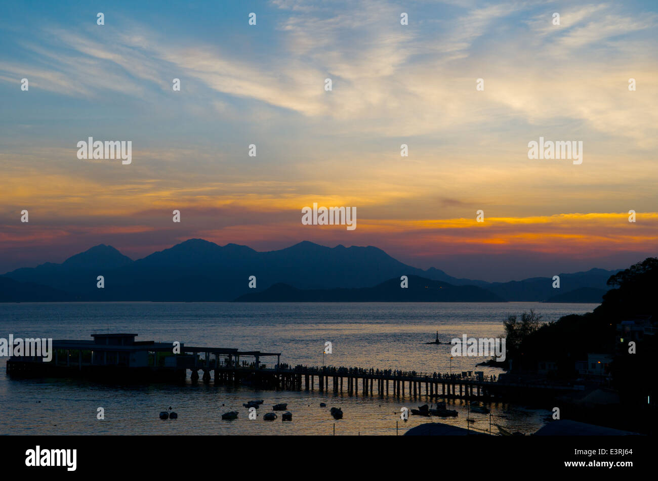 sunset / sundown over the Lamma Island ferry pier, Yung Shue Wan, Lamma ...