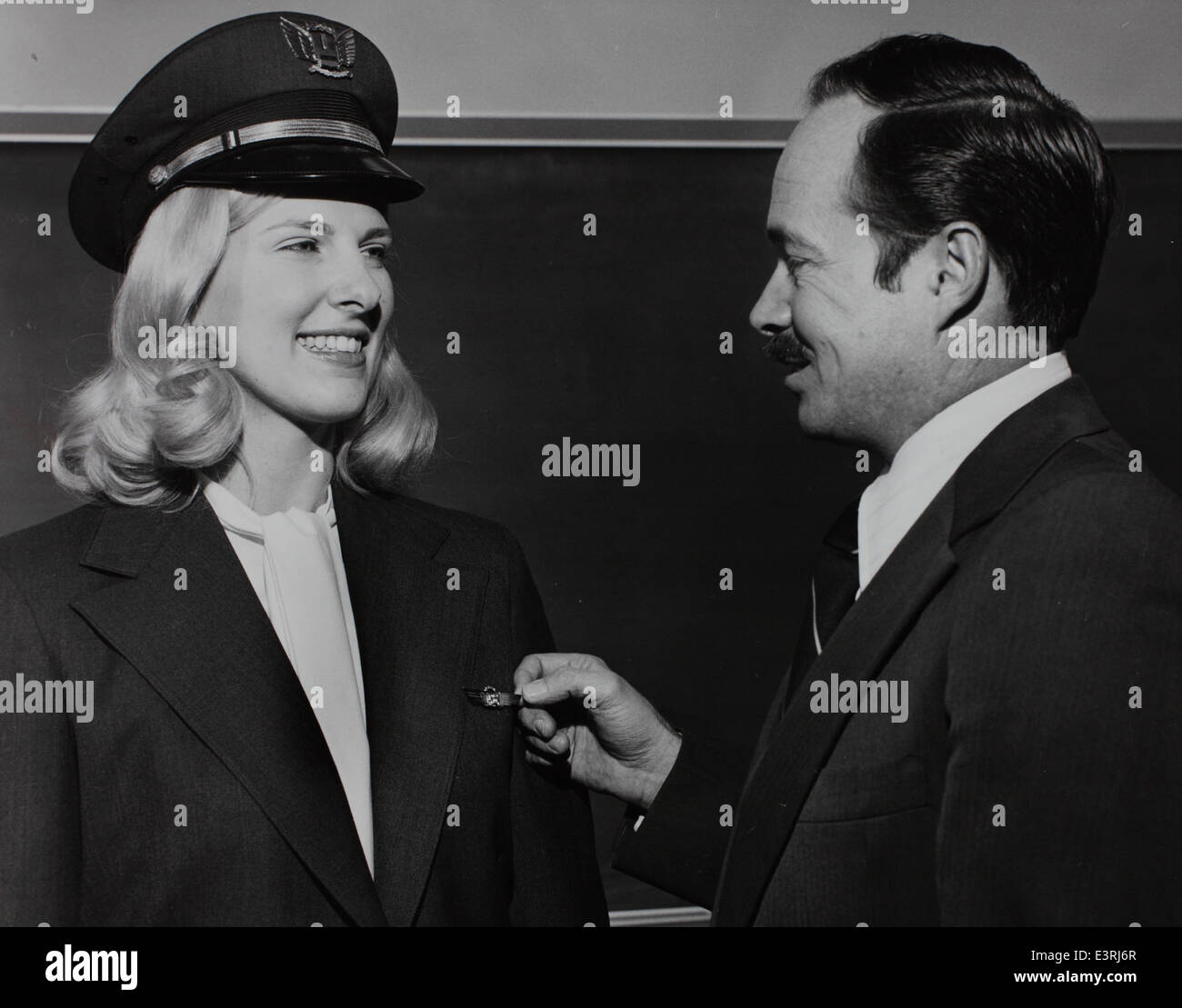 This historical photo highlights a female pilot from United Air Lines ...