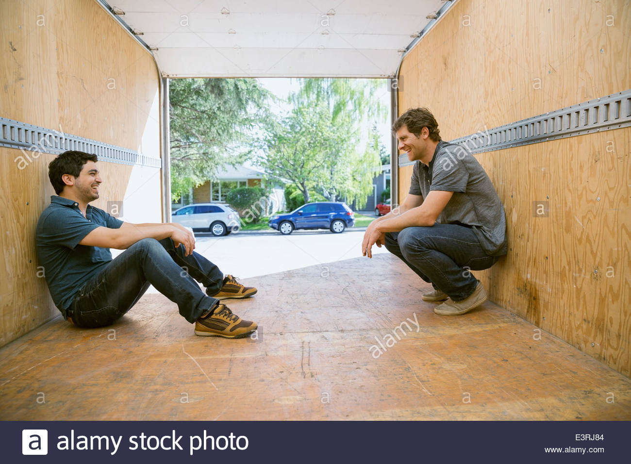 Two men talking in house hi-res stock photography and images - Alamy
