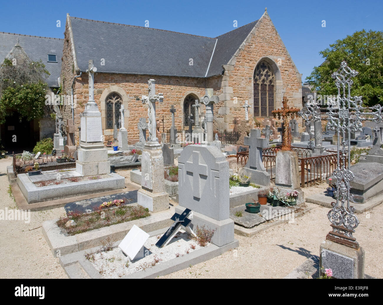 sunny illuminated scenery at a cemetery on the Ile de Brehat in ...