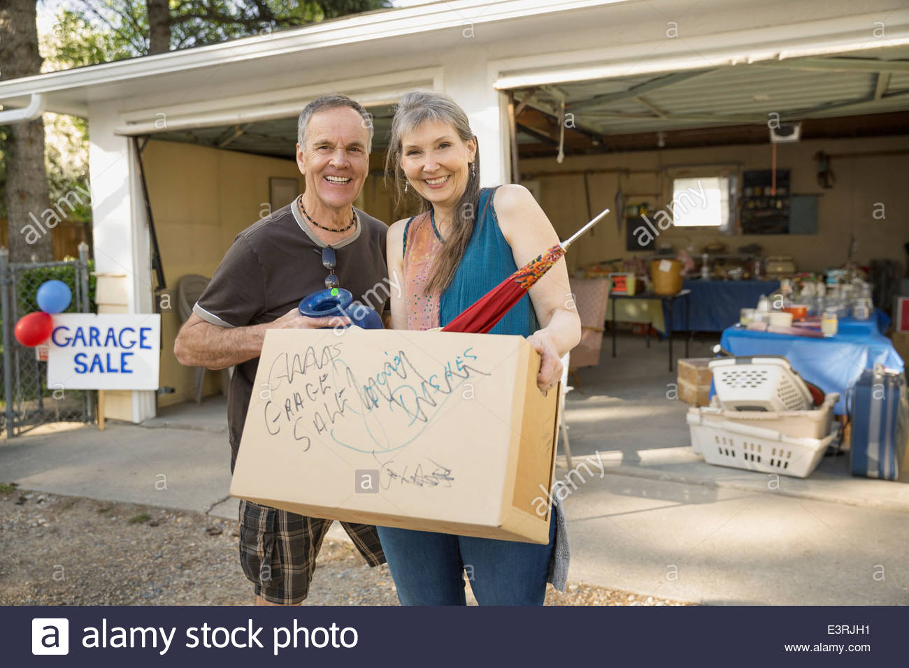 Woman garage sale box hi-res stock photography and images - Alamy