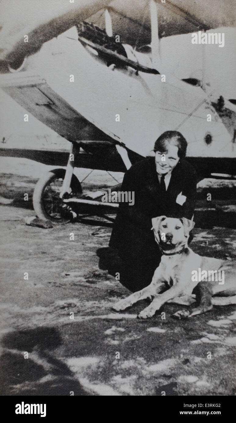 Amelia Earhart is shown with Neta Snook's dog in this 1921 photograph ...
