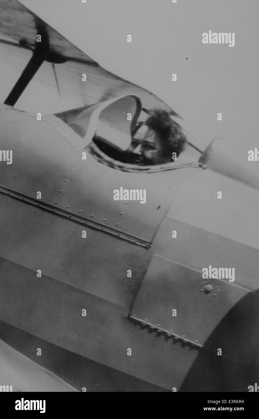 This image showcases a woman pilot in the cockpit, highlighting the ...