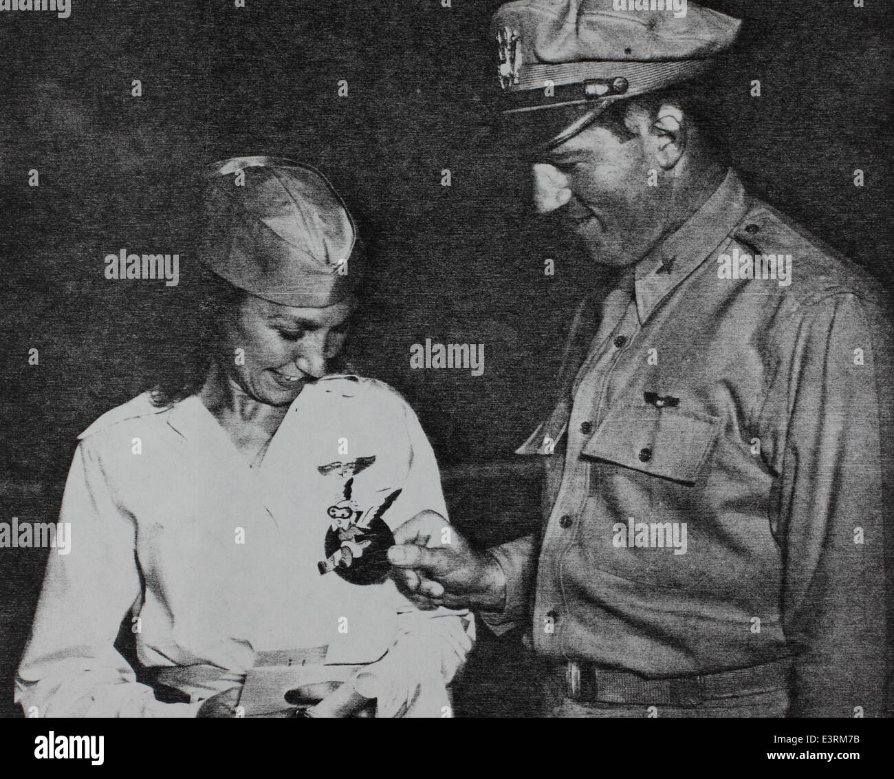 Captain Girrons presents the Fifinella Badge during World War II, a ...