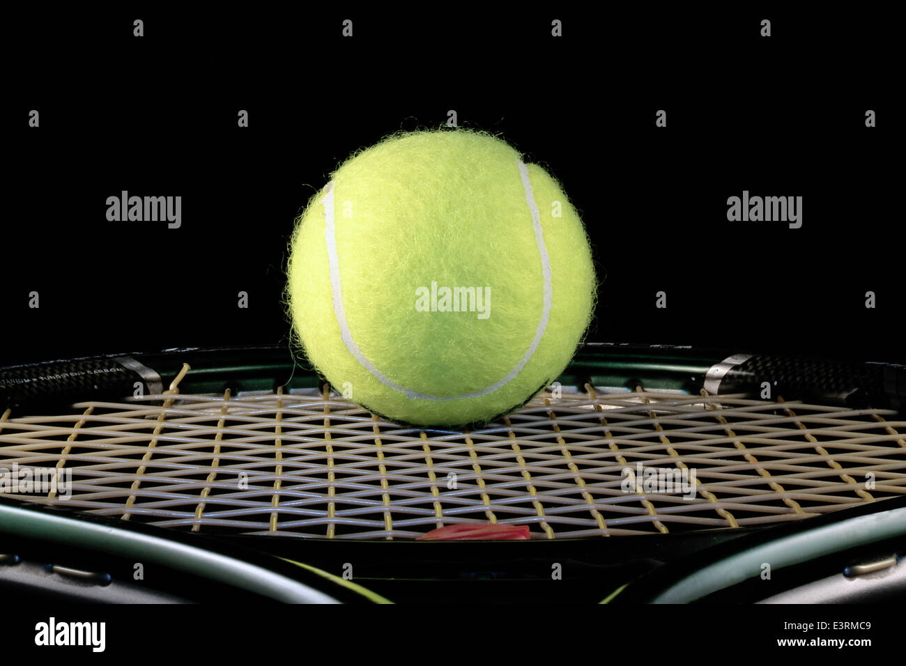 ball and tennis racket on black background Stock Photo - Alamy