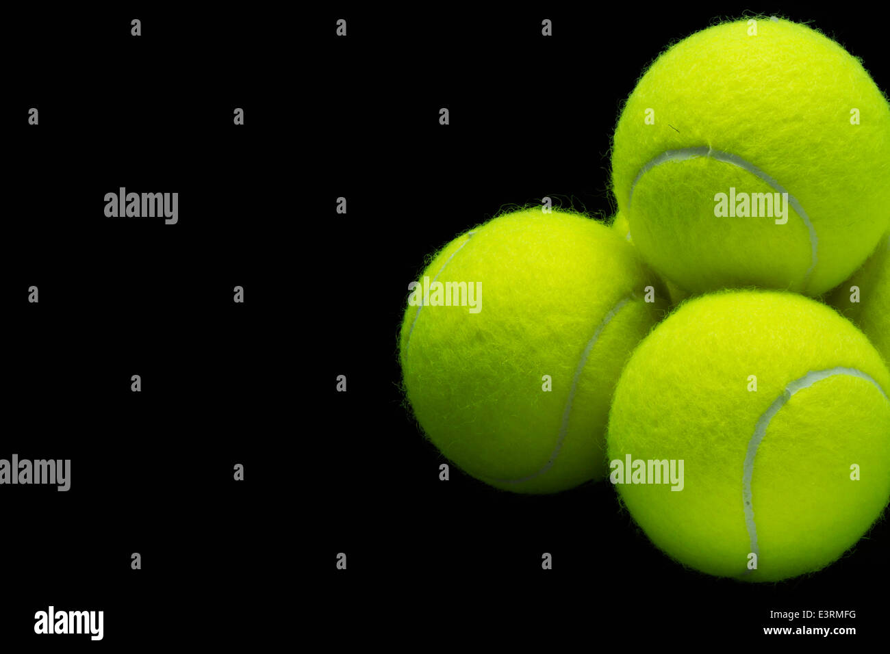 tennis balls on black background Stock Photo - Alamy