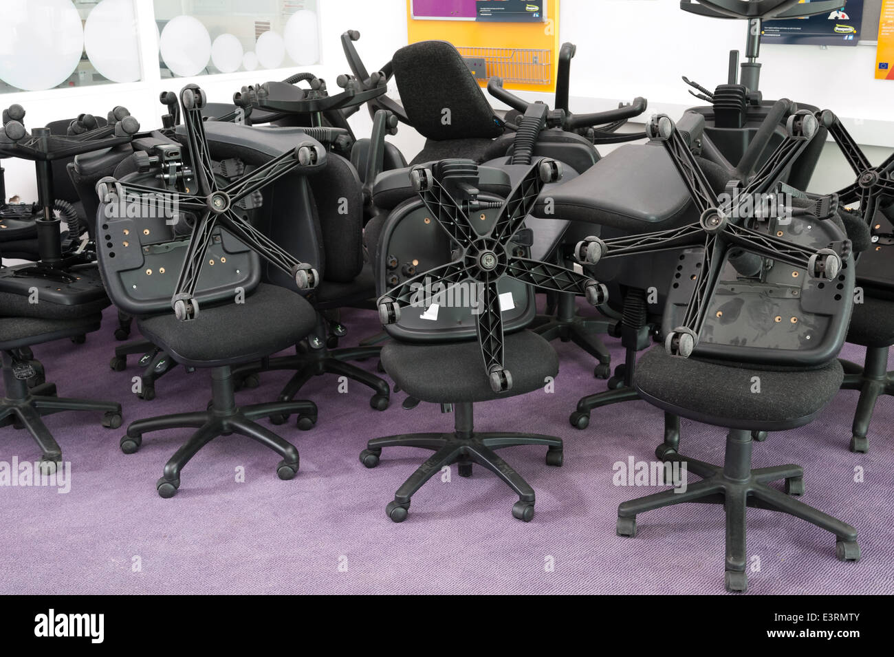 new build or closure of offices computer chairs stacked piled up ...