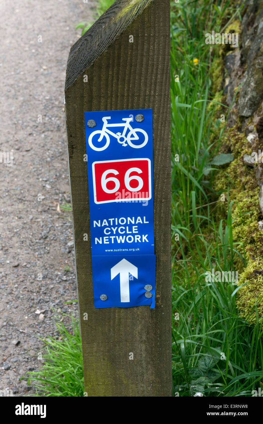 National Cycle Network signpost on the canal towpath near Luddenden ...