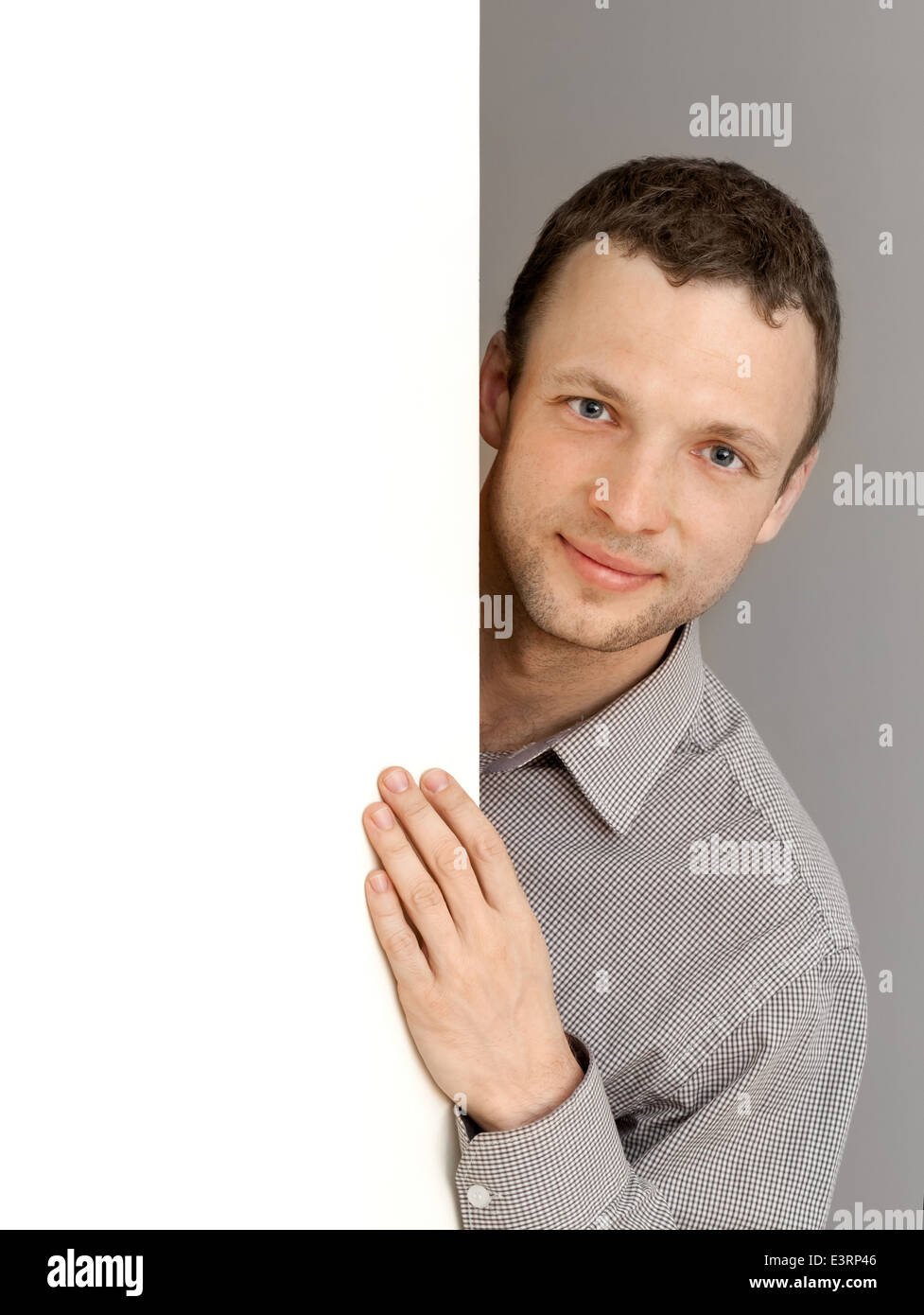 Young Caucasian Man, vertical studio portrait with white wall Stock ...