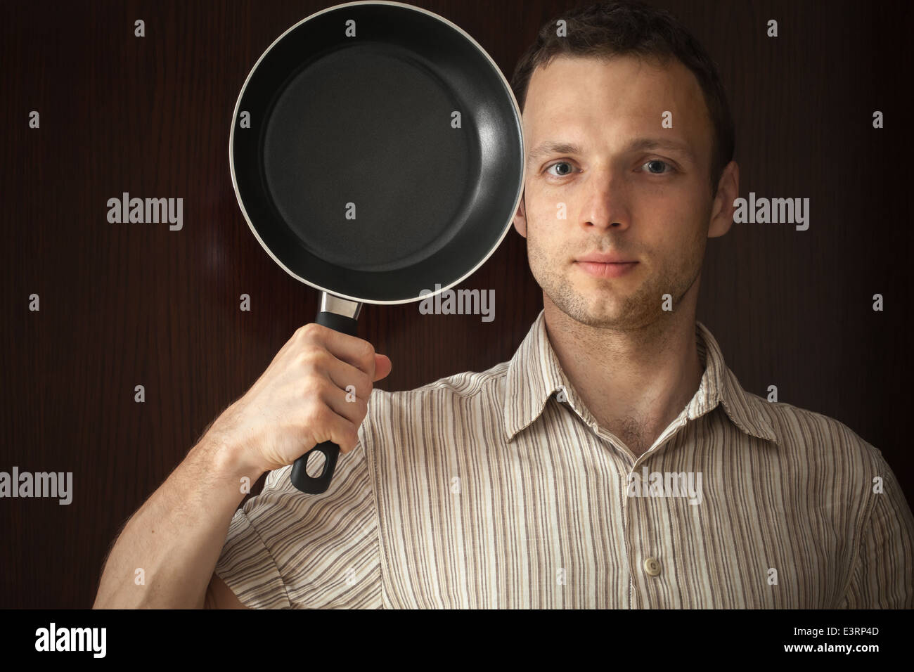 Man frying food with frying pan hi-res stock photography and images - Alamy