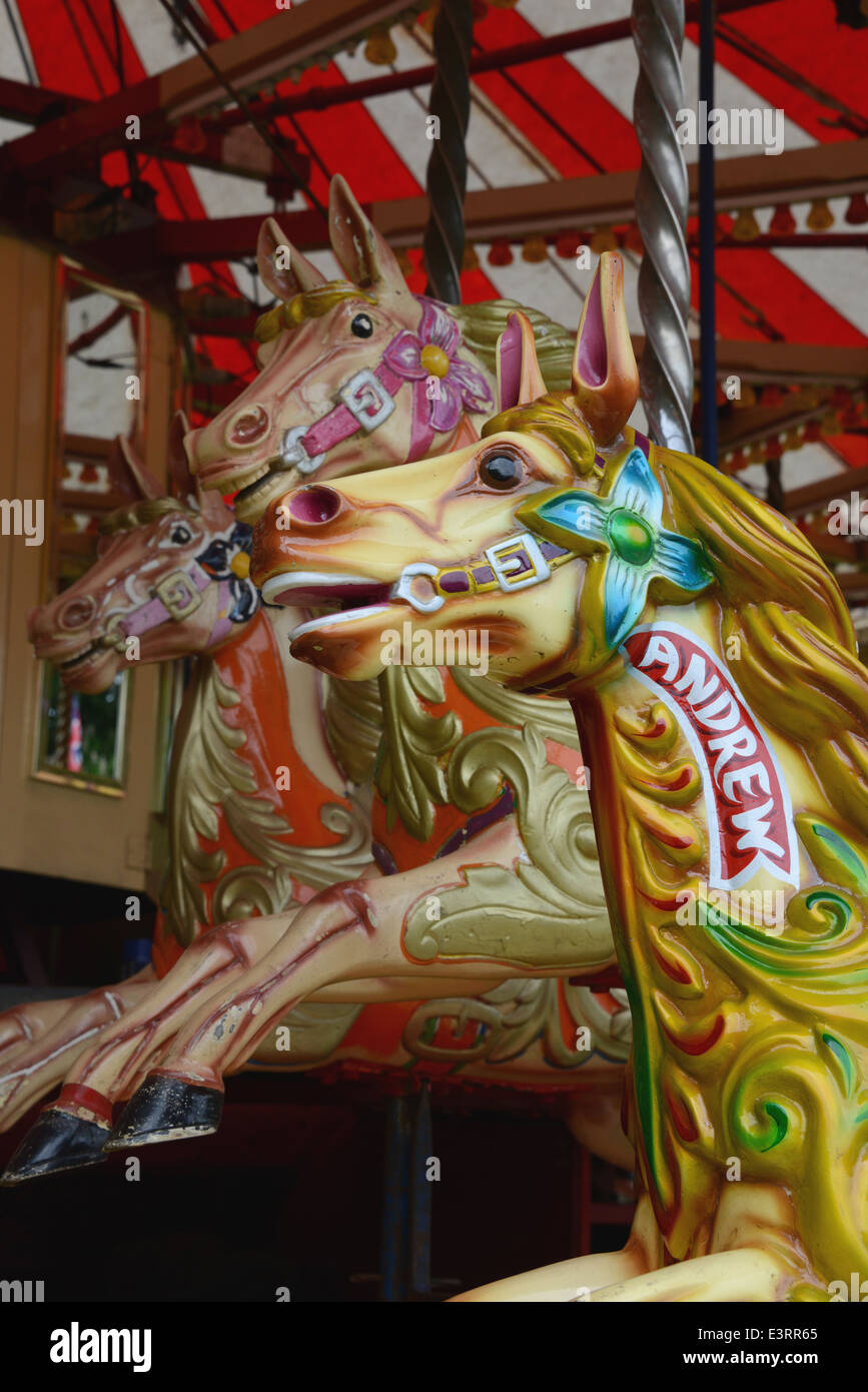 Roundabout horses to ride Stock Photo - Alamy