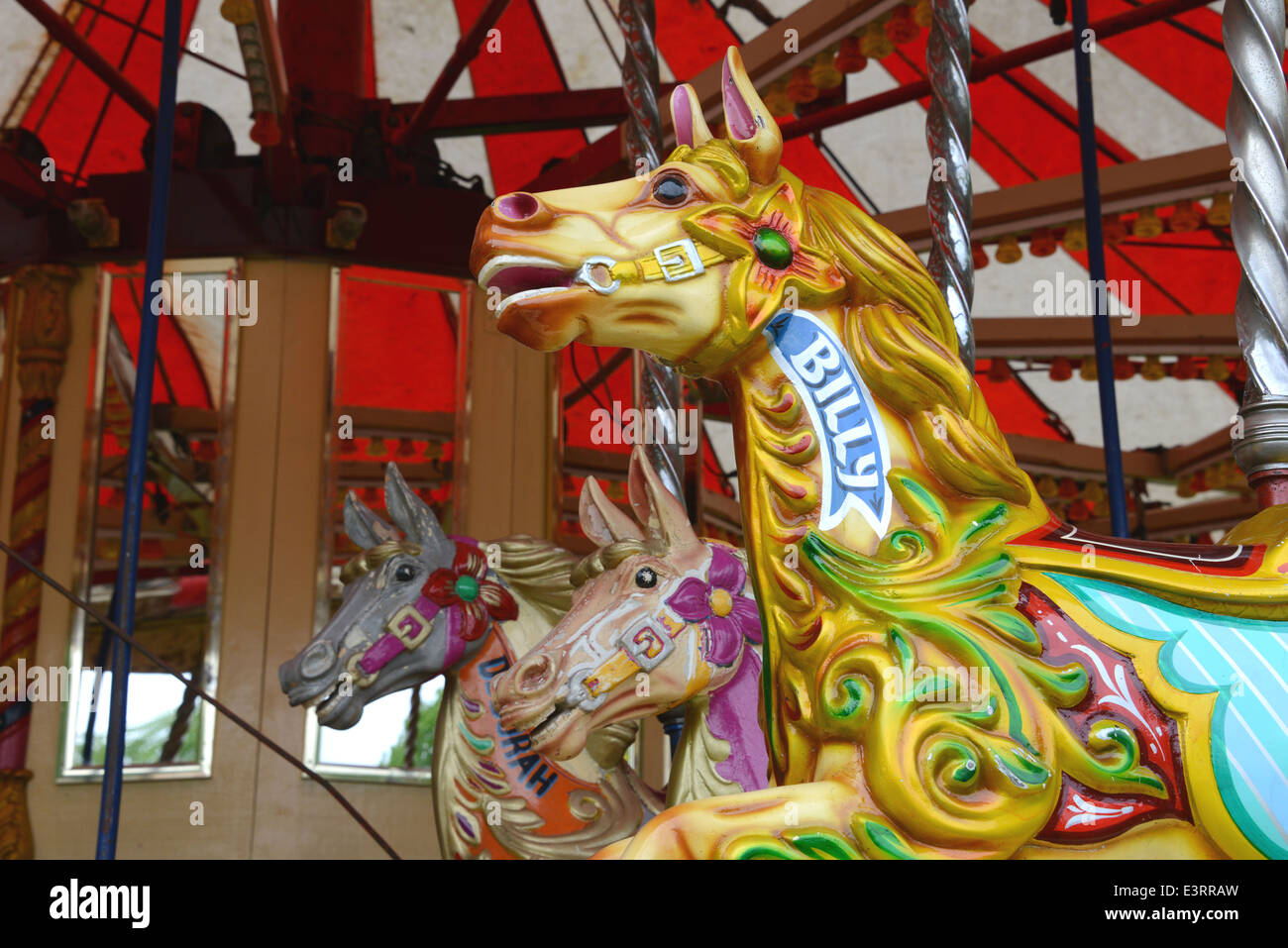 Roundabout horses to ride Stock Photo - Alamy