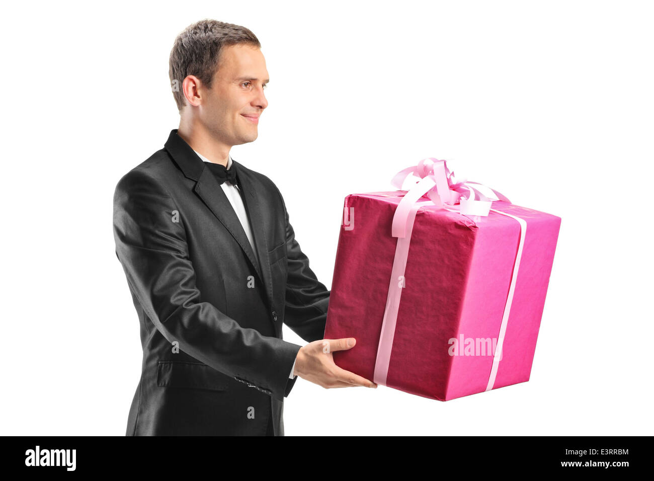 Handsome young man holding a big present Stock Photo - Alamy
