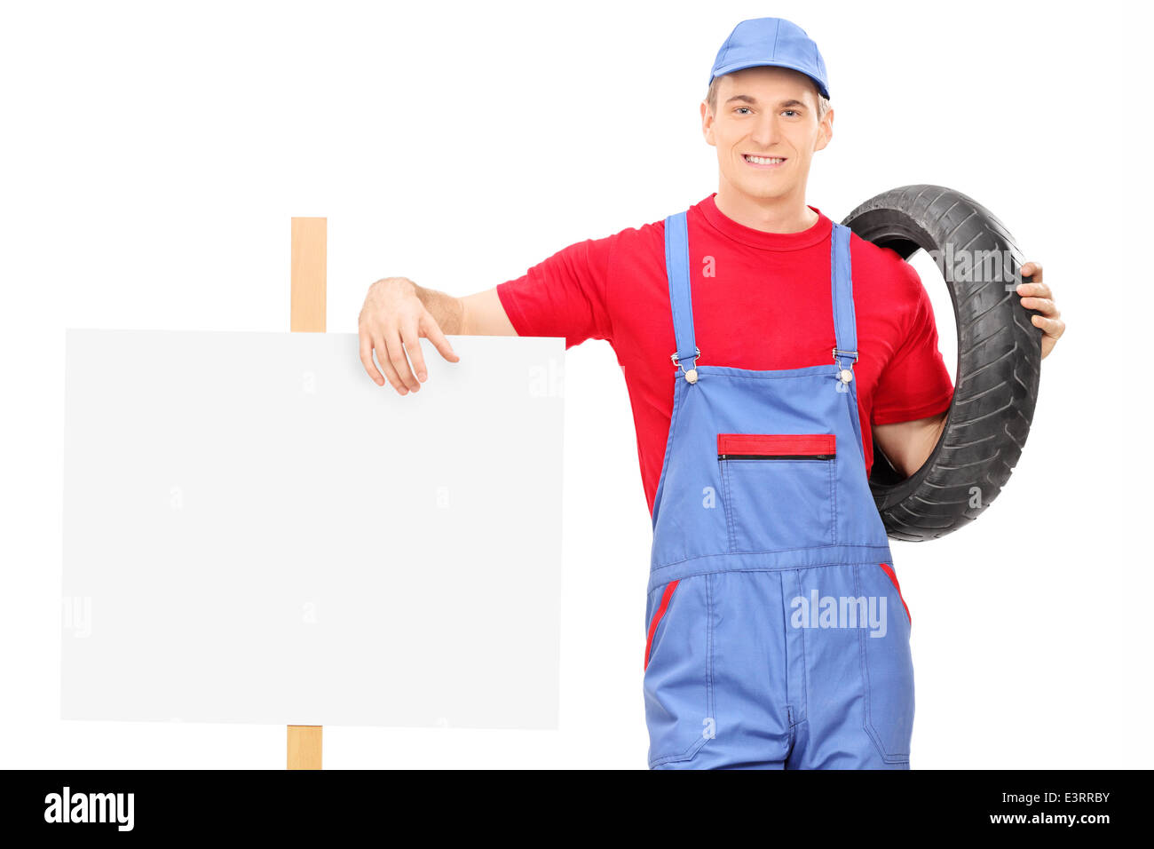 Mechanic holding banner Cut Out Stock Images & Pictures - Alamy