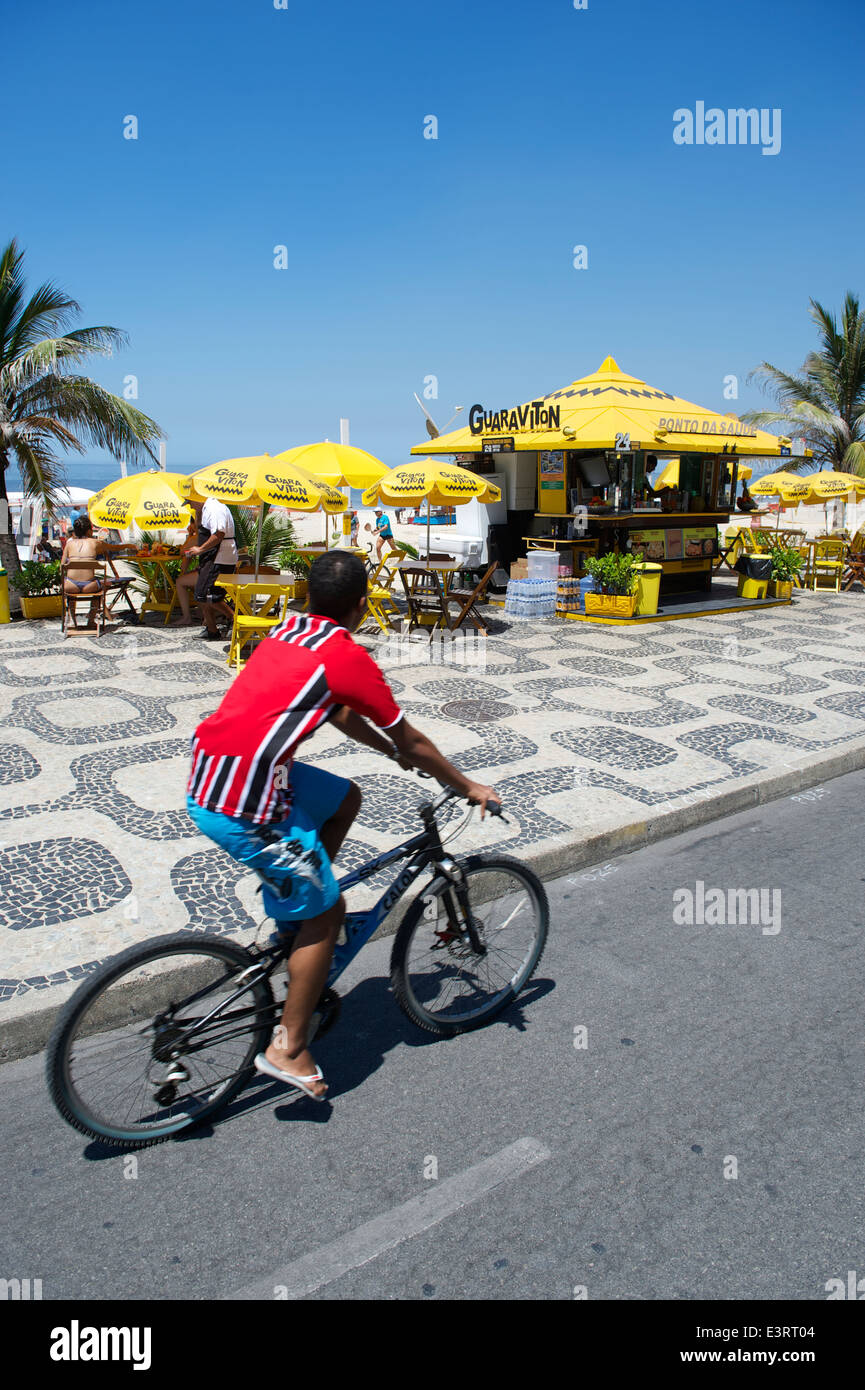 RIO DE JANEIRO, BRAZIL - FEBRUARY 11, 2014: A Brazilian man rides a ...