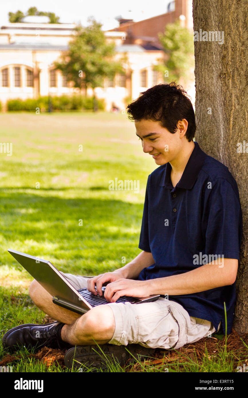 College student with laptop on campus Stock Photo - Alamy