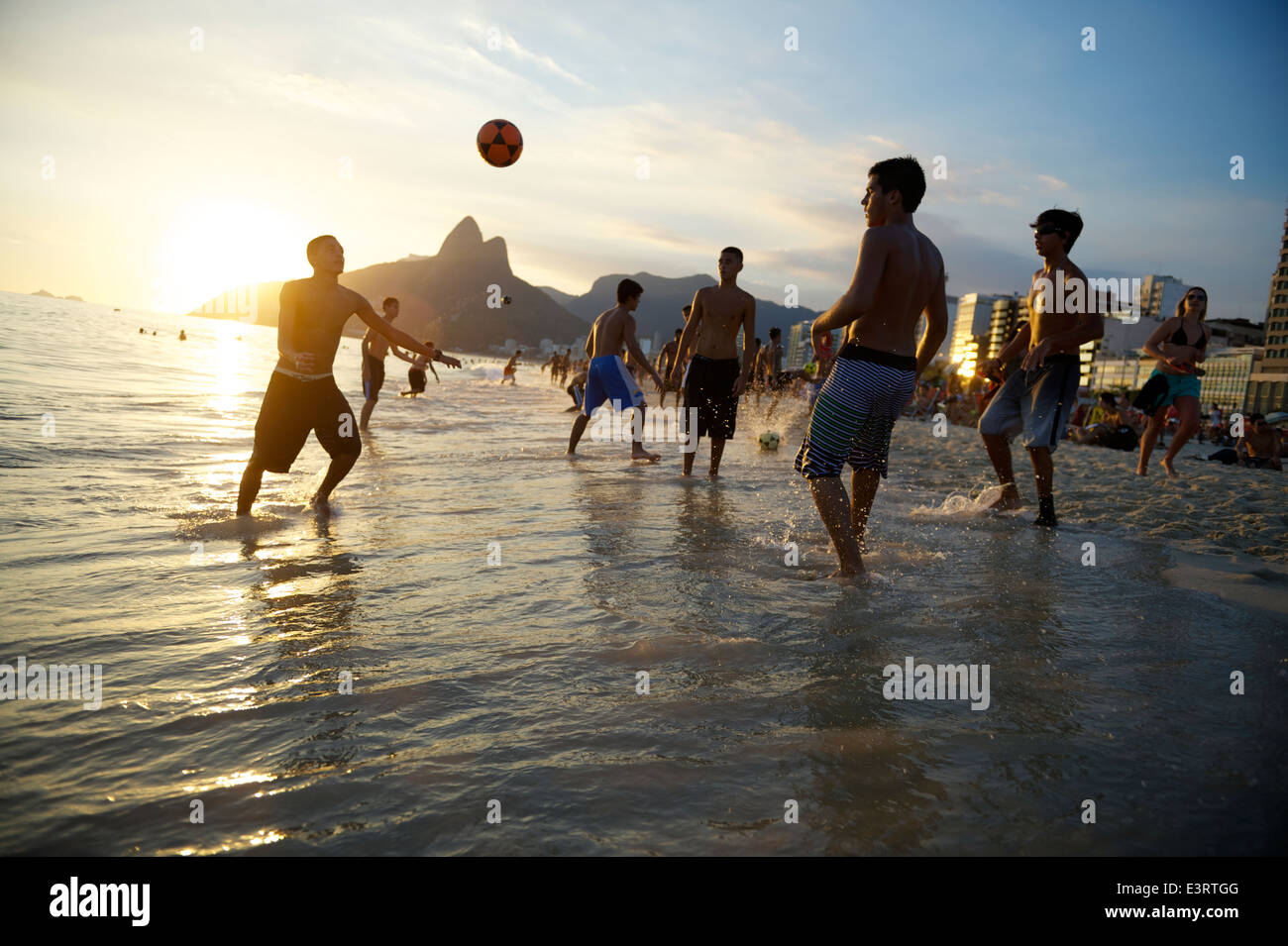 RIO DE JANEIRO, BRAZIL - JANUARY 25, 2014: Young Brazilians play keepy ...