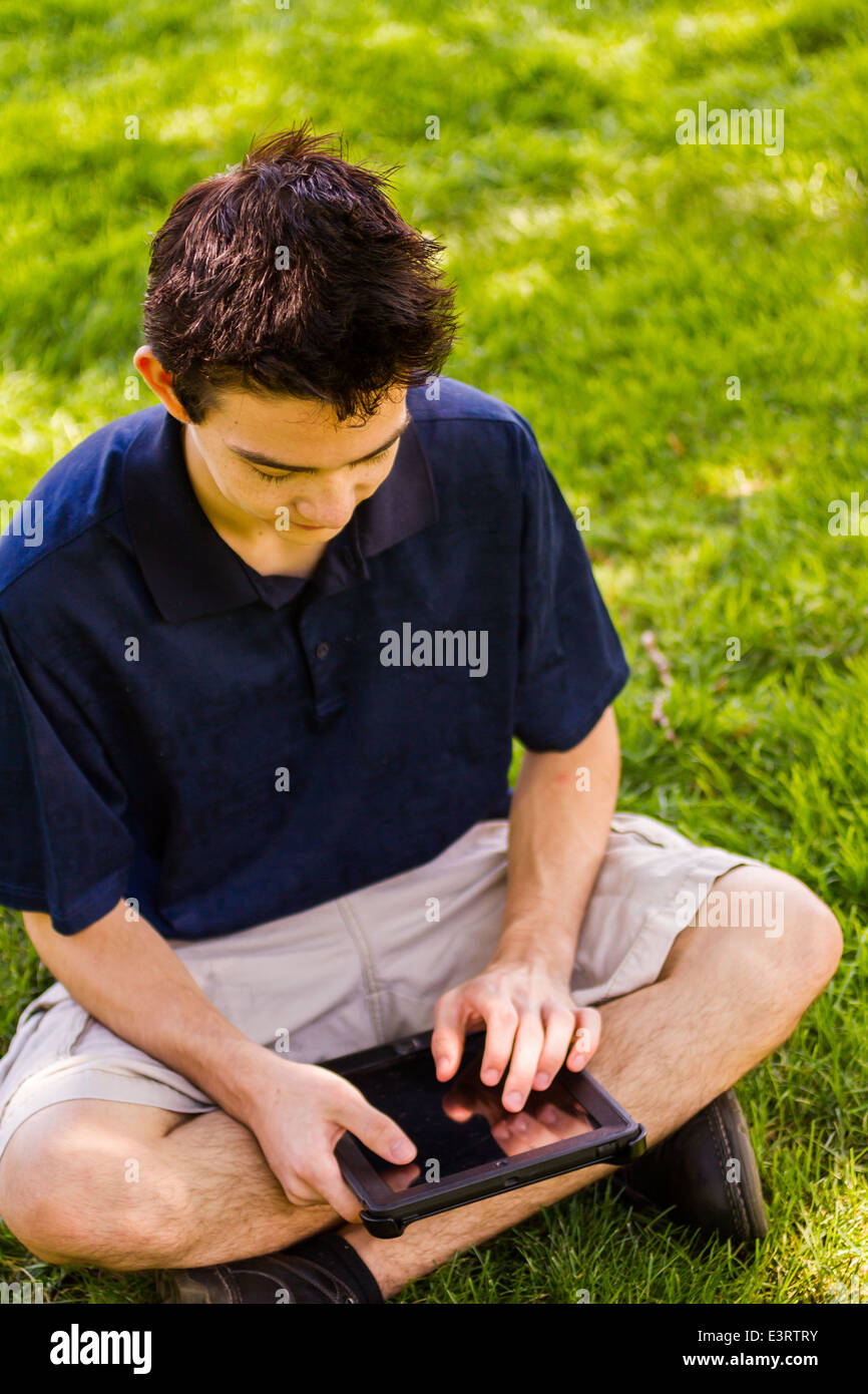 College student with computer tablet on campus Stock Photo - Alamy